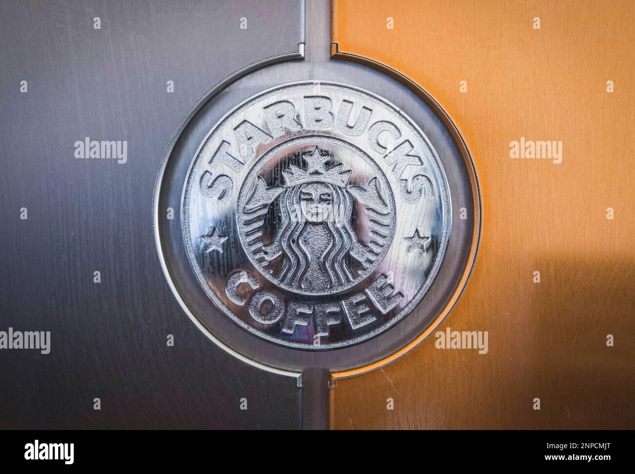 Shiny Starbucks emblem in a coffee shop in Poland Stock Photo - Alamy