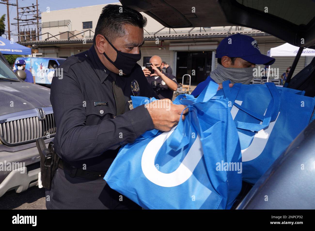 Los Angeles Police Dept. South Bureau commander Al Labrada loads ...
