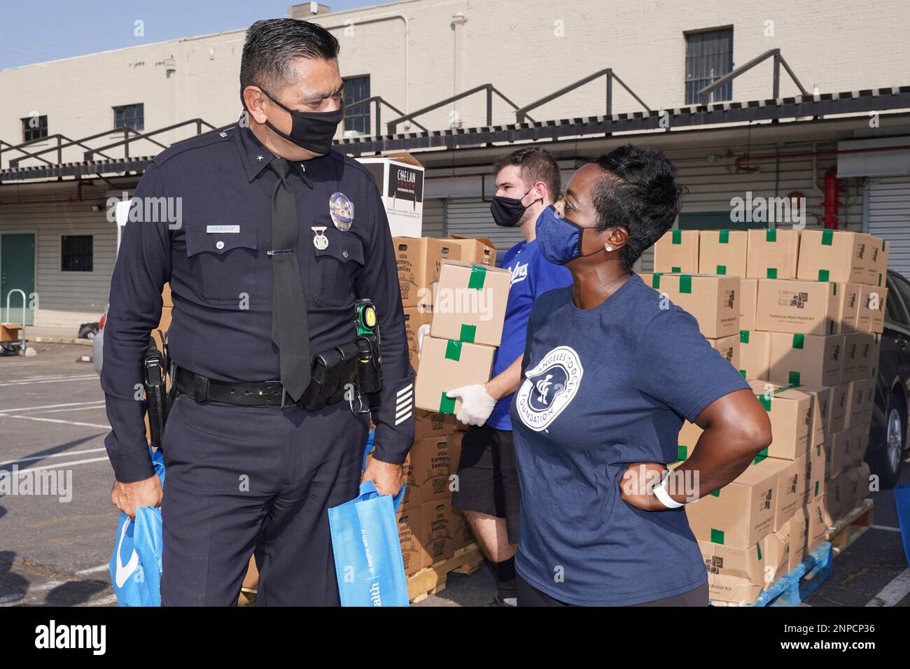 Los Angeles Police Dept. South Bureau commander Al Labrada (left) talks ...