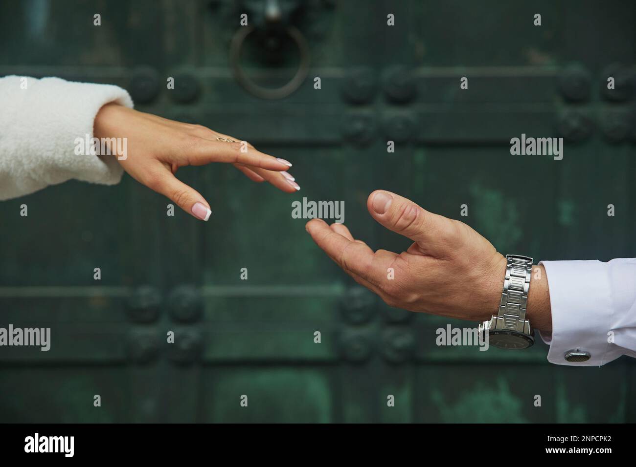 A couple in love reaches out to each other with their hands Stock Photo ...