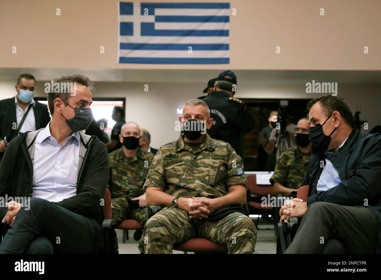 Greece's Prime Minister Kyriakos Mitsotakis, left, Greek Defense ...