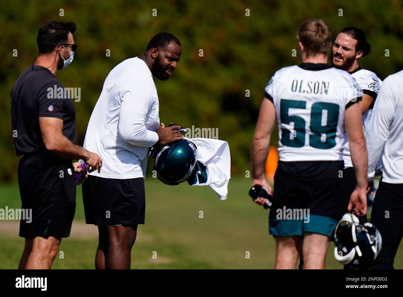 Philadelphia Eagles' Fletcher Cox, second from left, stretches before ...