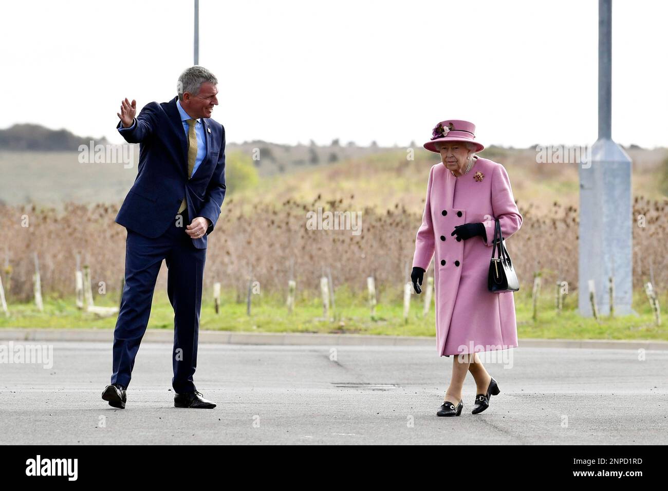 Britain's Queen Elizabeth II is greeted by Chief Executive Gary ...