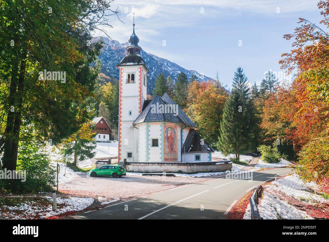 Church between the Alpine Range and Lake Bohinj in Slovenia Stock Photo ...