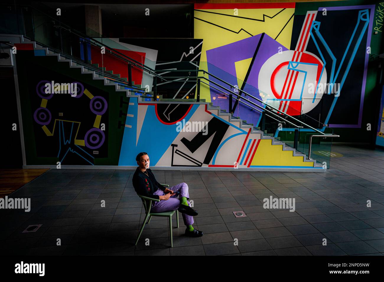 Bristol artist Rosa ter Kuile, aka 'RTiiiKA', sits in front of a 6x13 ...