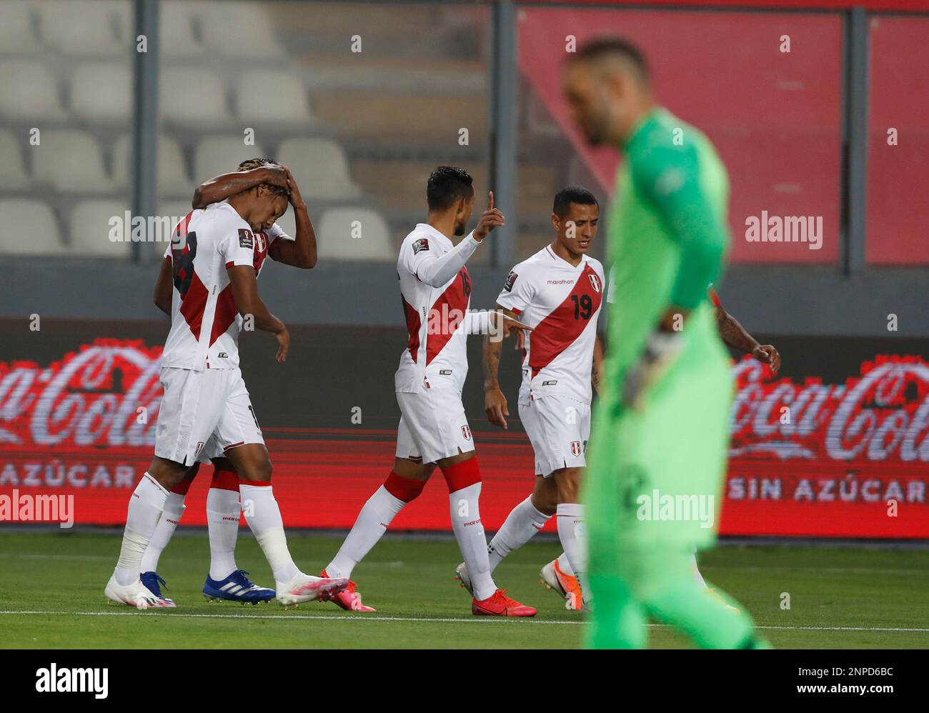 Peru's Andre Carrillo, left, celebrates with teammates after scoring ...