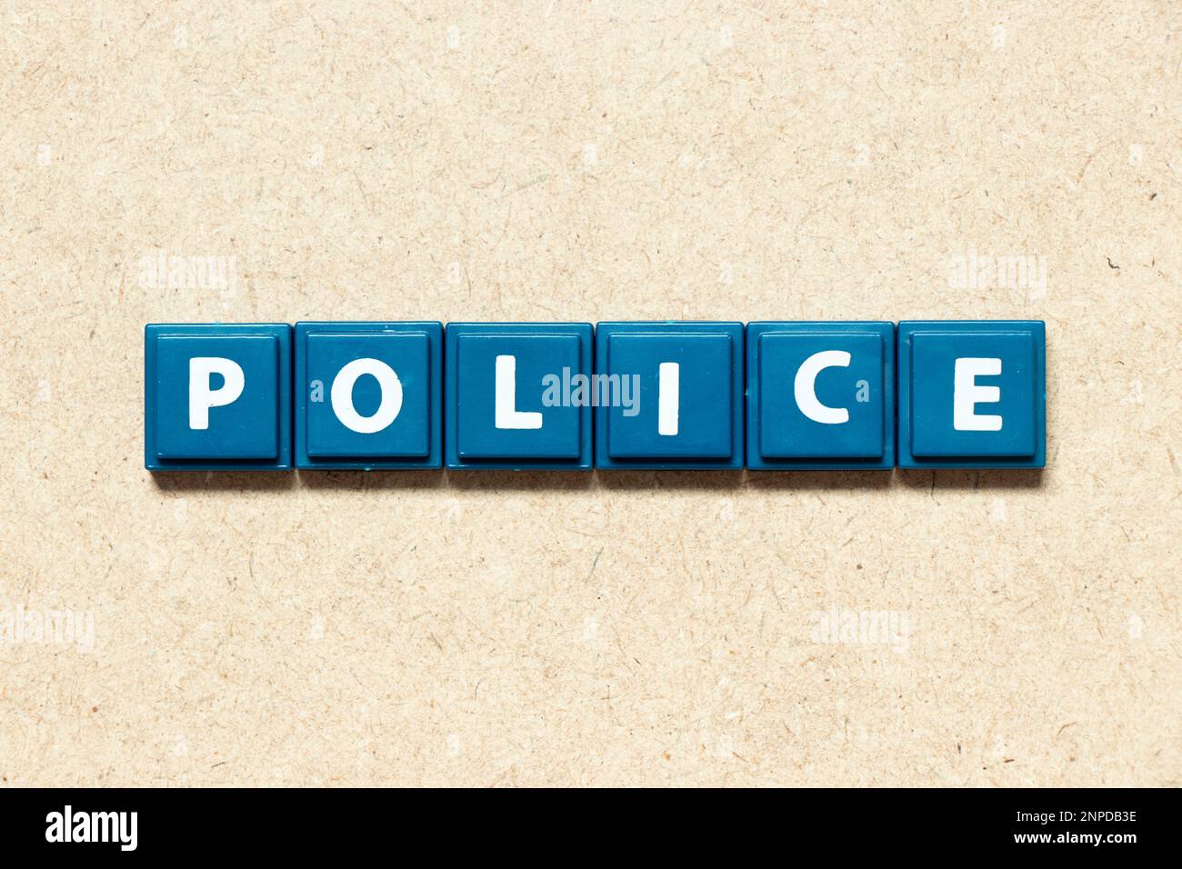 Tile alphabet letter in word police on wood background Stock Photo - Alamy
