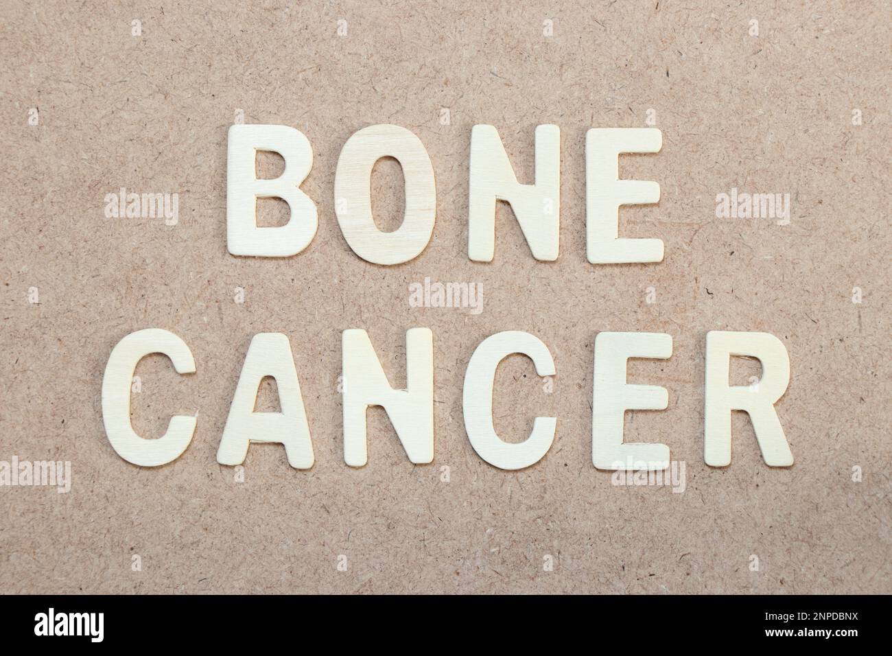Wood alphabet letter in word bone cancer on wood background Stock Photo ...