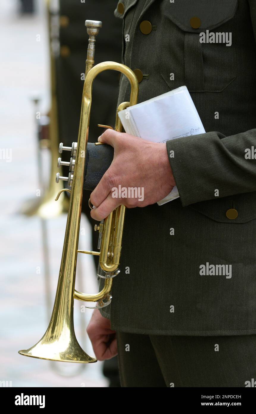 Man trumpeter in military uniform holding trumpet and papers musical ...
