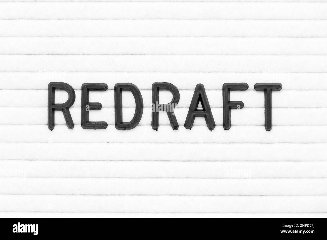 Black color letter in word redraft on white felt board background Stock ...