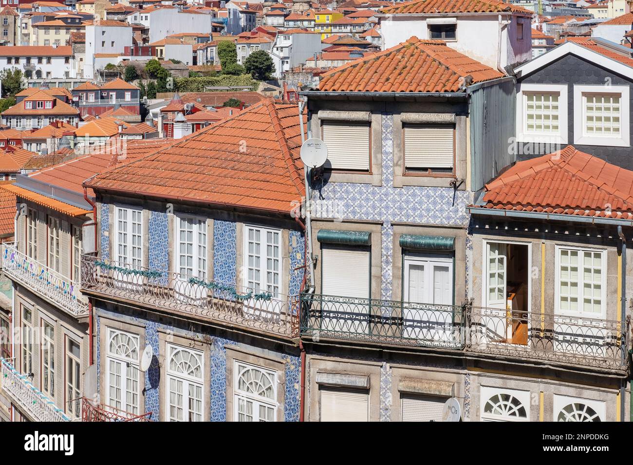 Terraced houses with facades adorned with colorful tiles, ornate ...