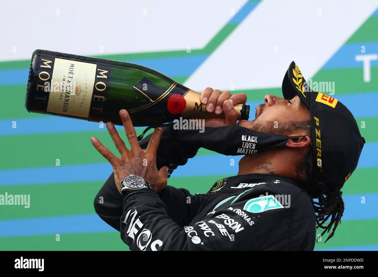 Mercedes driver Lewis Hamilton of Britain, drinks champagne on the ...