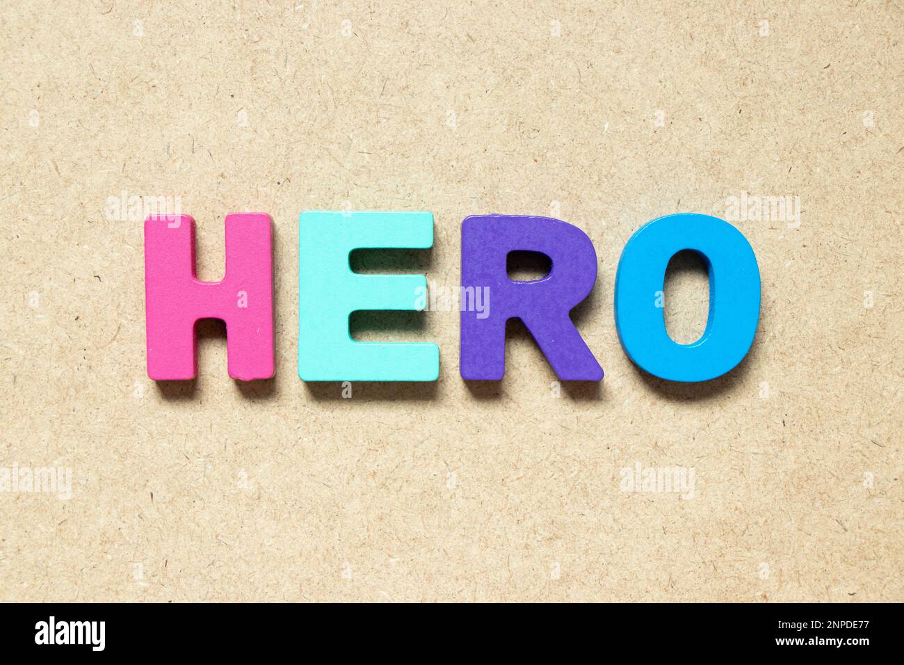 Color alphabet letter in word hero on wood background Stock Photo - Alamy