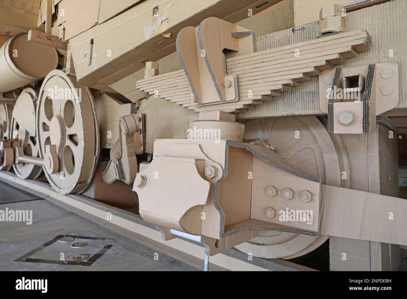 A photo shows a full-scale cardboard steam locomotive (SL) in Nankan ...