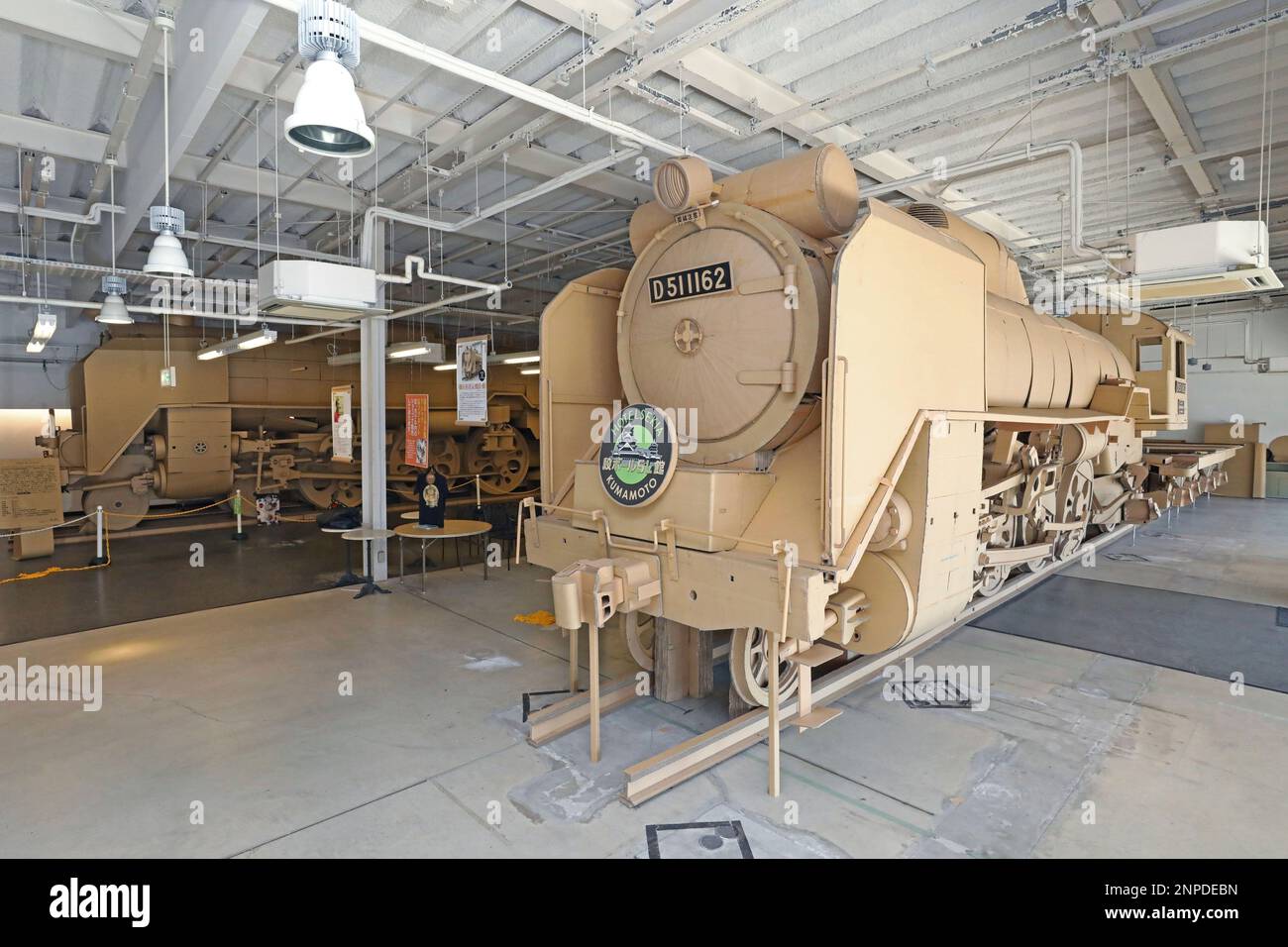 A photo shows a full-scale cardboard steam locomotive (SL) in Nankan ...