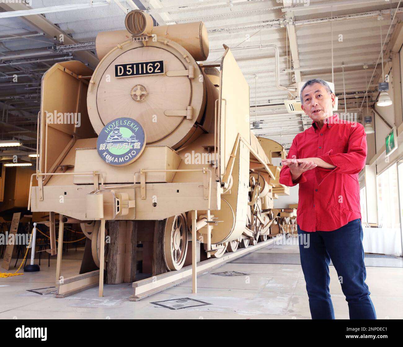 A photo shows a full-scale cardboard steam locomotive (SL) in Nankan ...