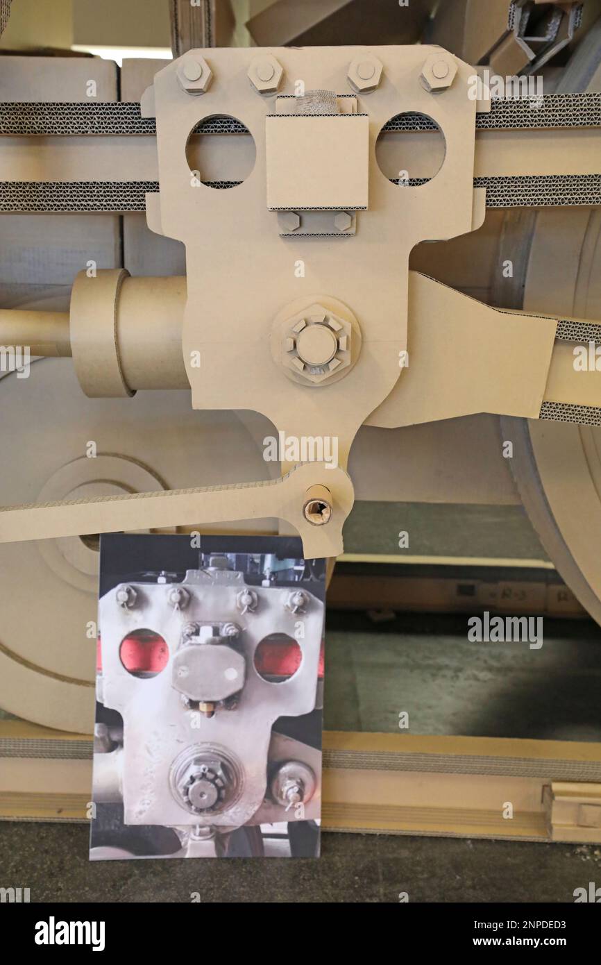 A photo shows a full-scale cardboard steam locomotive (SL) in Nankan ...