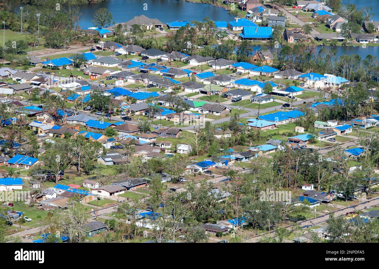 Blue tarps cover houses in the aftermath of Hurricane Delta, Saturday ...