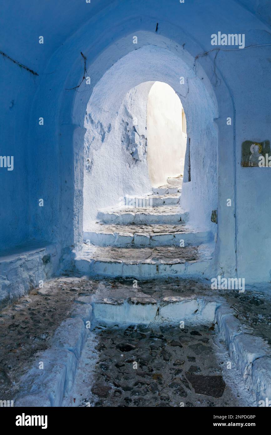 A series of stone steps leading through an archway in the traditional ...