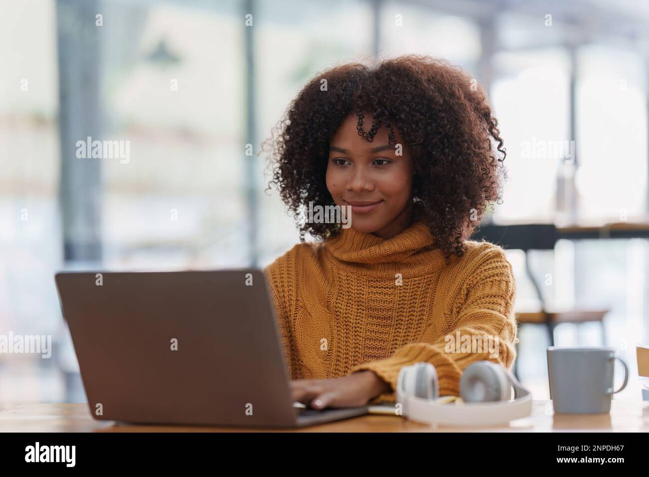 Young black African woman university student learning online using ...