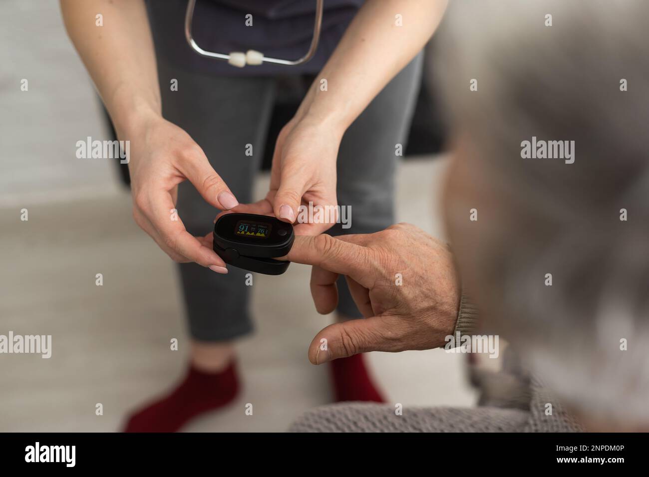 Nurse use pulse oximeter to check patient's oxygen in home , Home ...