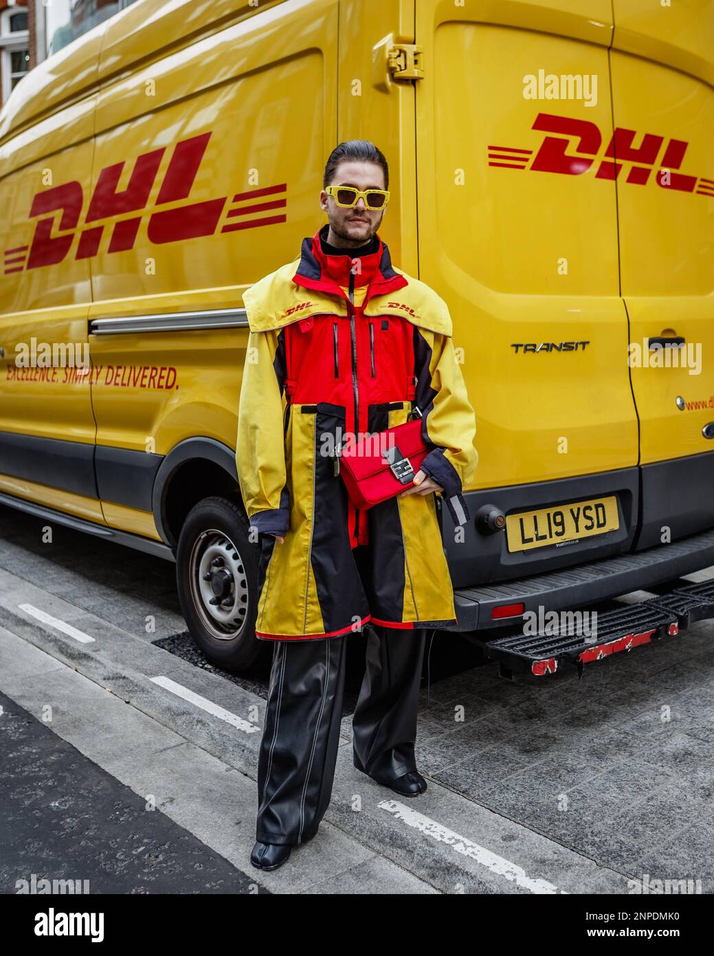 DHL fans fashion at London Fashion Week Stock Photo - Alamy