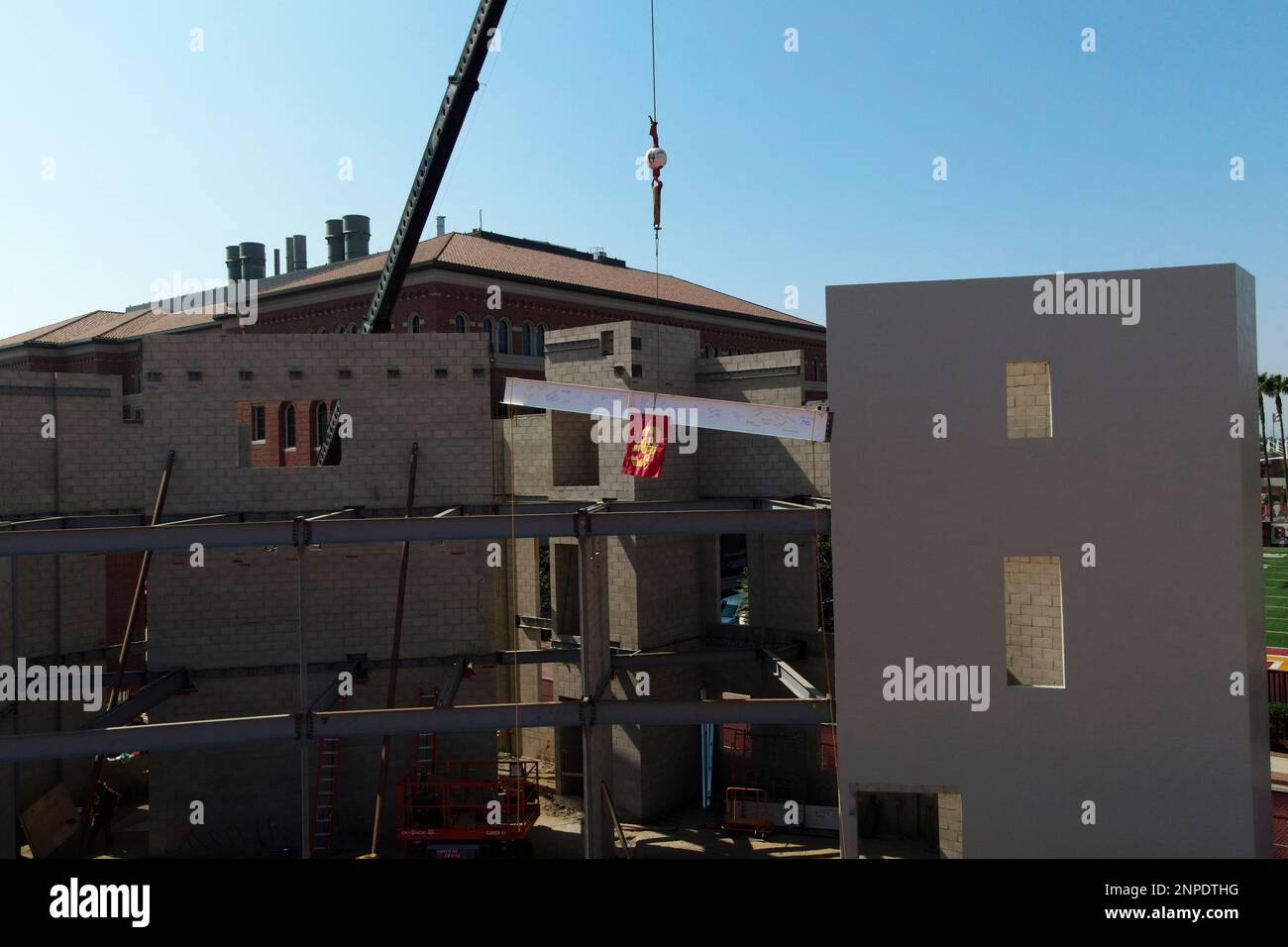 Workers lift the final beam during a topping off ceremony during ...