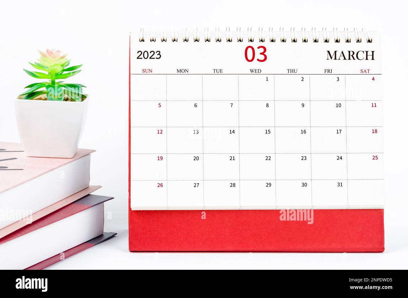 arch 2023 Monthly desk calendar for 2023 year with books on white ...