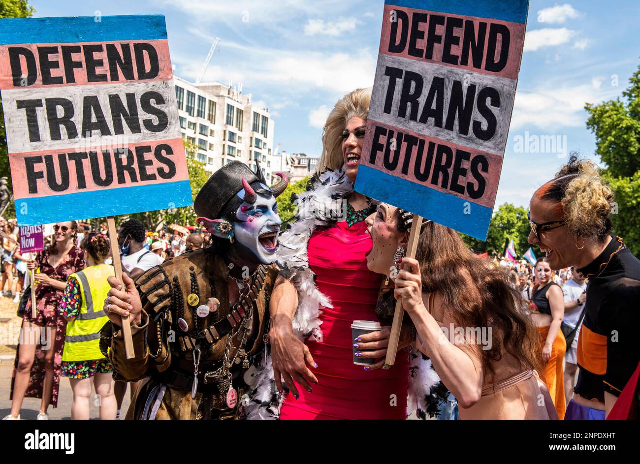 A group of members of the LGBTQ+ community with heavily painted and ...
