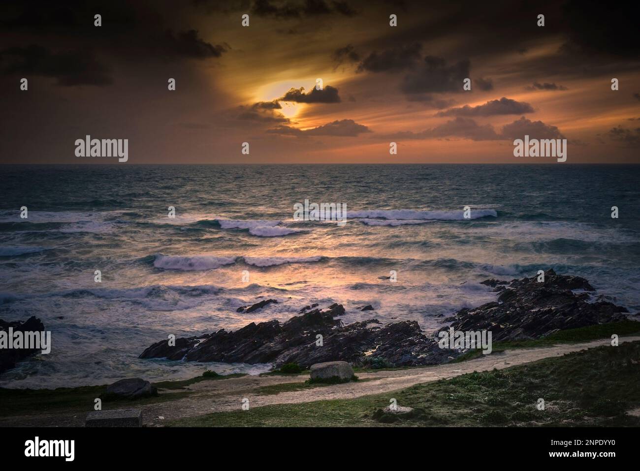 A spectacular sunset over Fistral Bay In Newquay in Cornwall in the UK ...