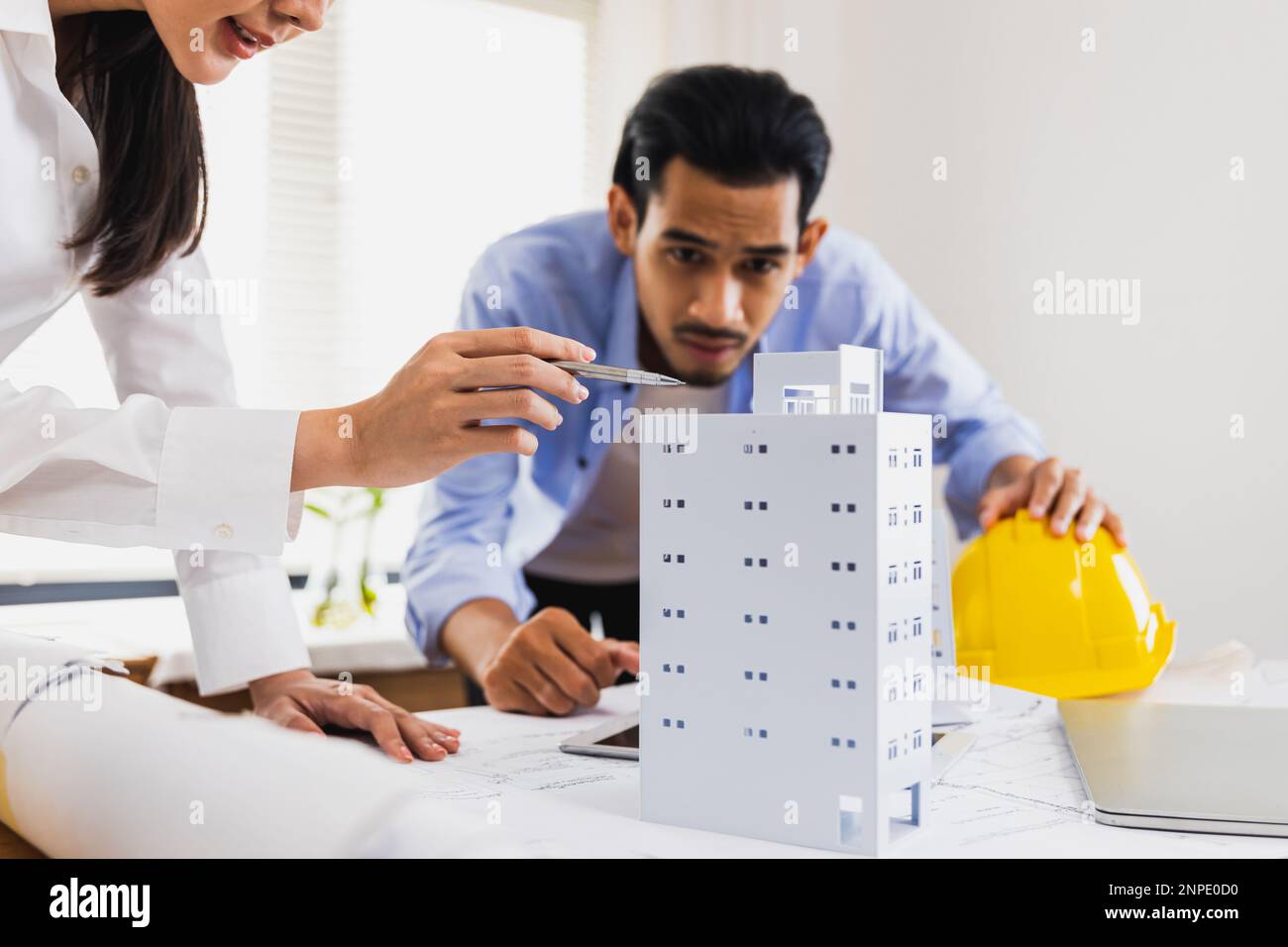 Architect team in office, engineer designers working in Office check ...