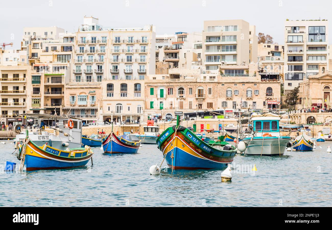 Colourful boats moored in Spinola Bay near to the Maltese capital city ...
