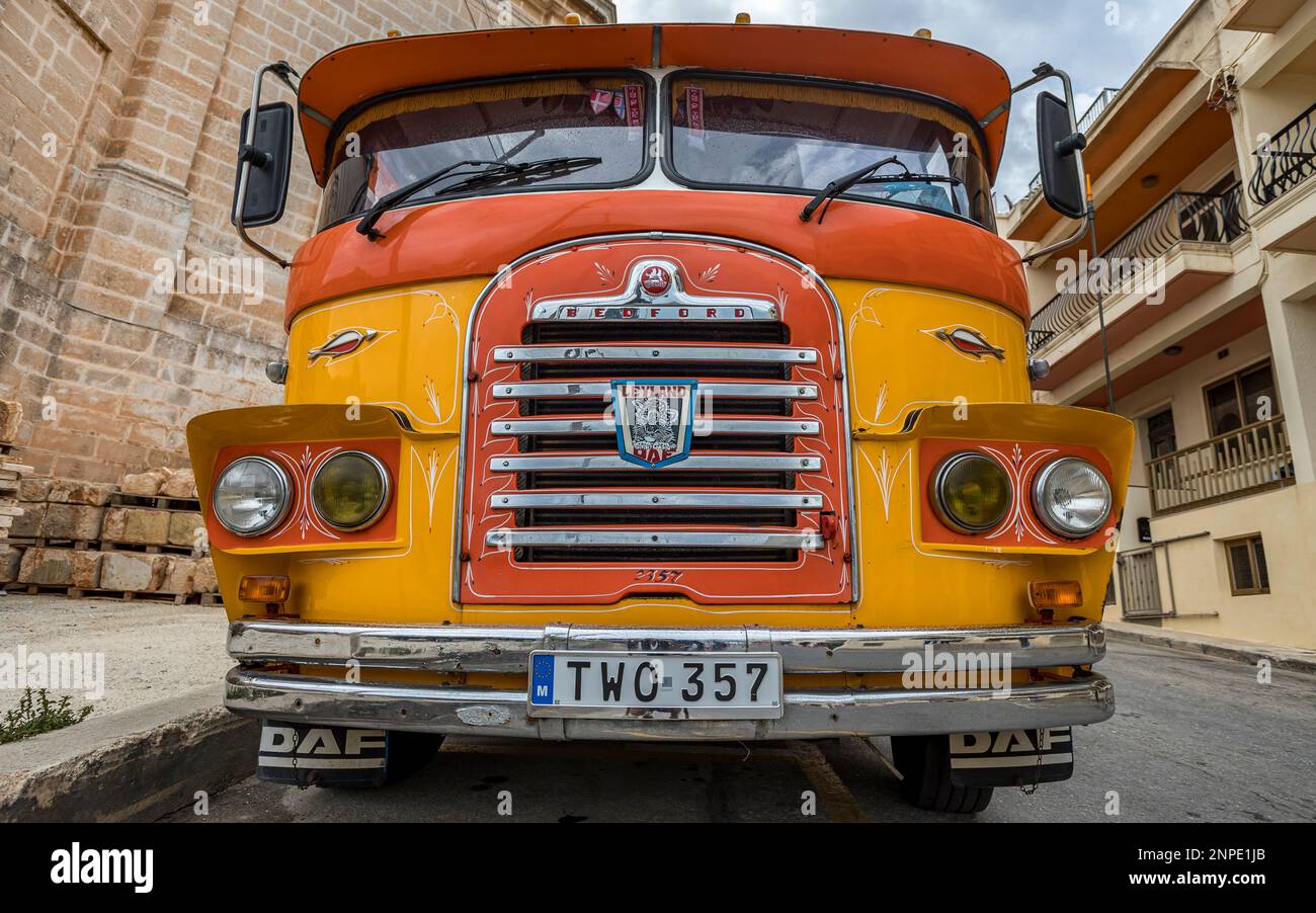 A vintage orange and yellow Leyland DAF bus seen in Mellieha in Malta ...