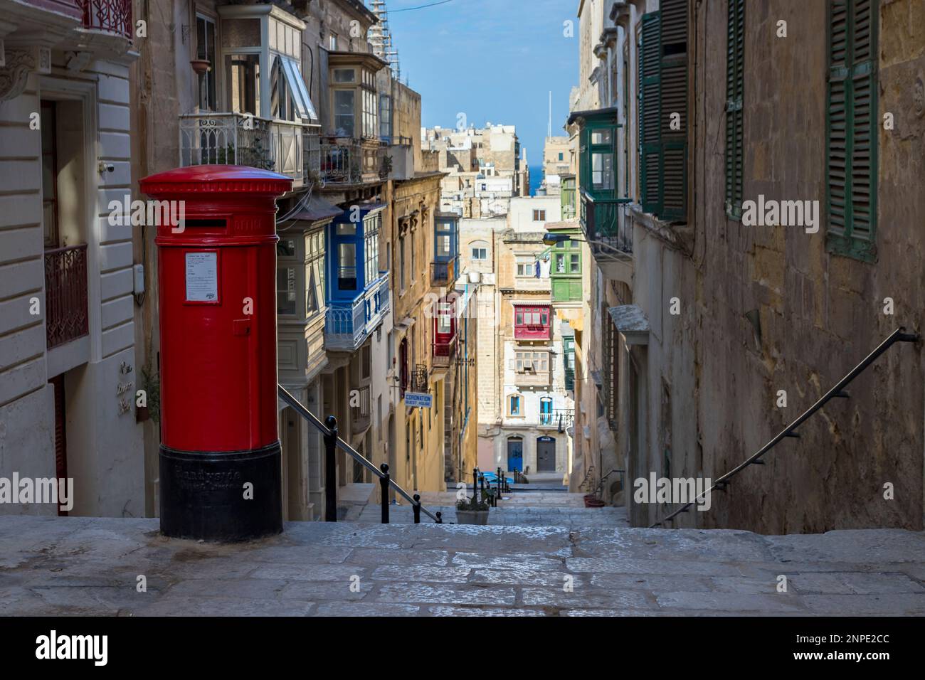 An old red post box seen above a steep street in Valletta in Malta ...