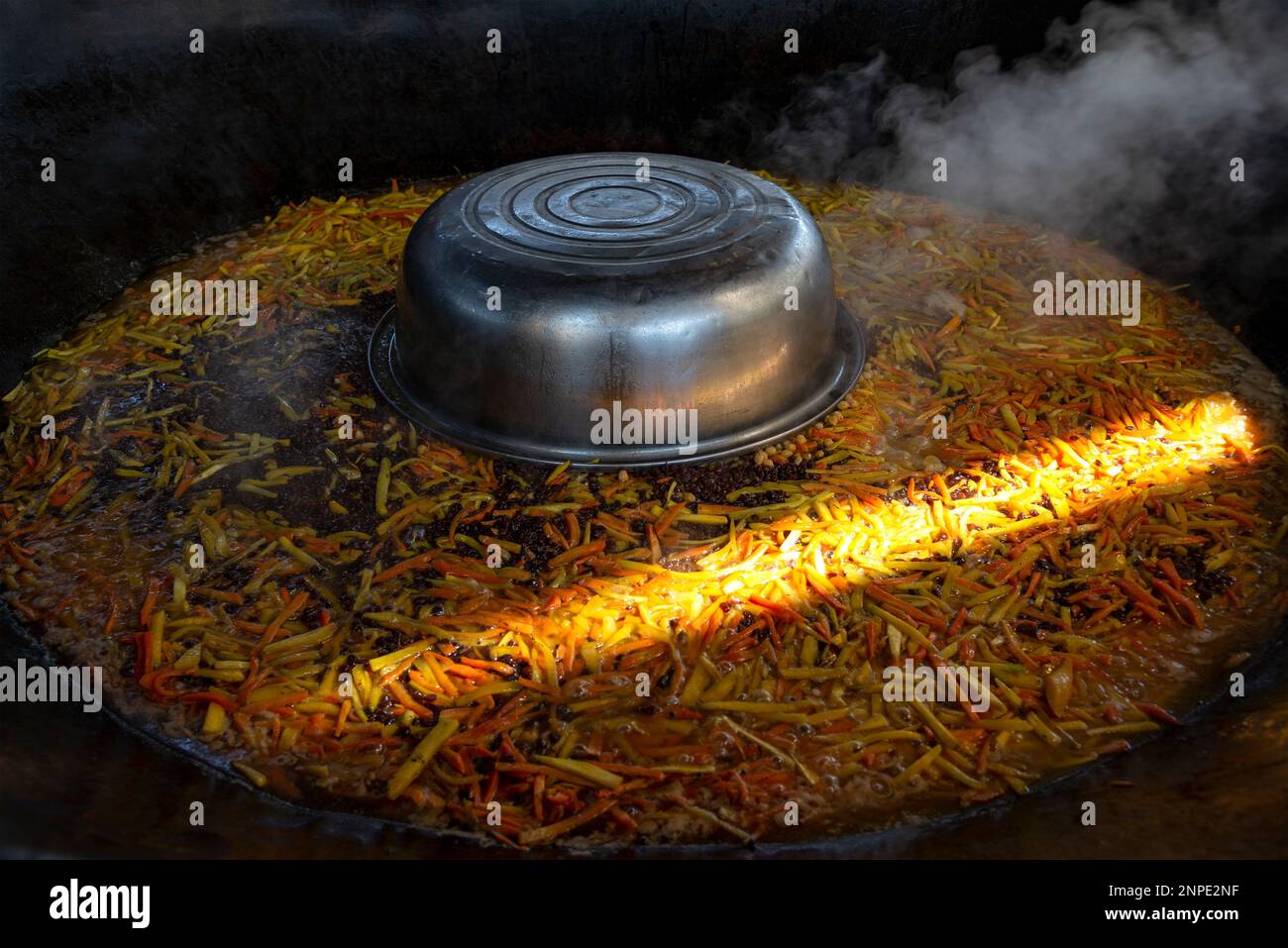 Cooking pilaf in close-up. Asian cuisine Stock Photo - Alamy