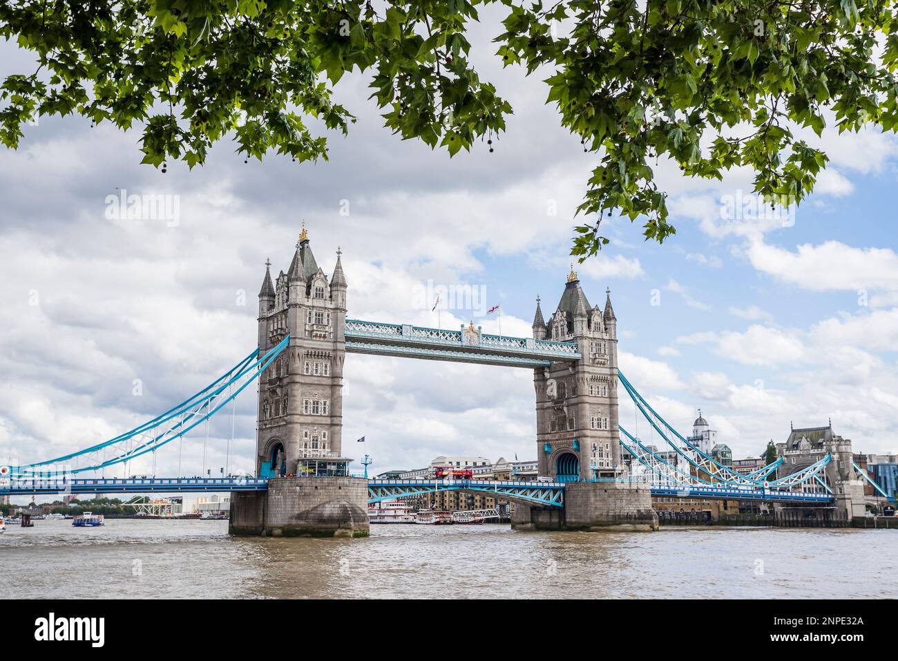 Tower Bridge spanning the River Thames in London seen under a frame of ...