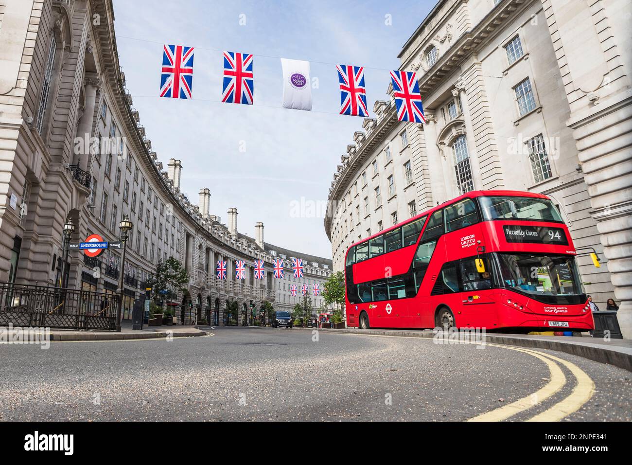 A traditional red double decker London bus at Piccadilly Circus under ...