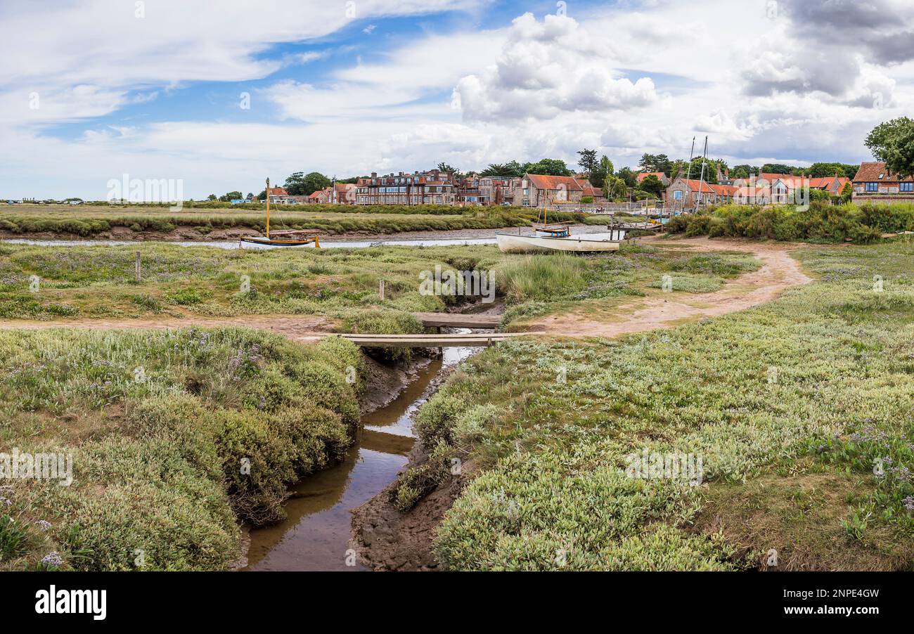 A view of makeshift wooden bridges over a channel of water at Blakeney ...