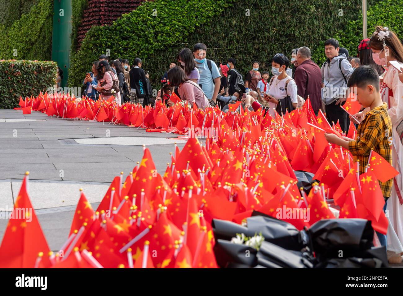 Tourists stand flags outside Sihang warehouse, which witnessed a heroic ...