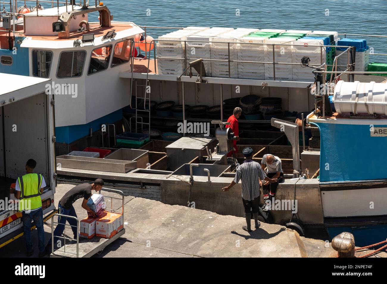 Cape Town, South Africa. 2023. Fishing boat crew loading supplies before departing to fish Stock ...