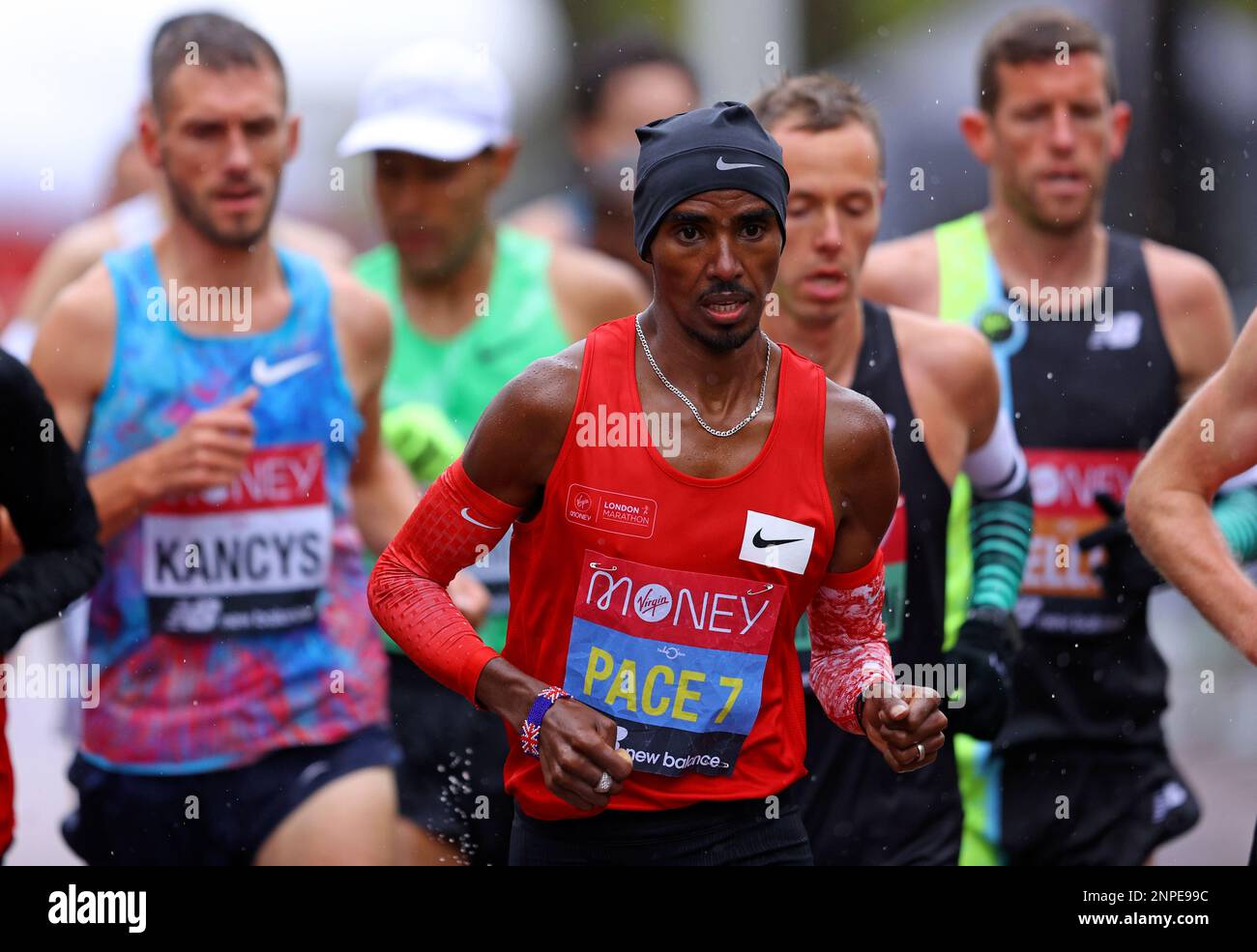 Britain's Mo Farah, center, runs as a pacemaker at the start of the ...