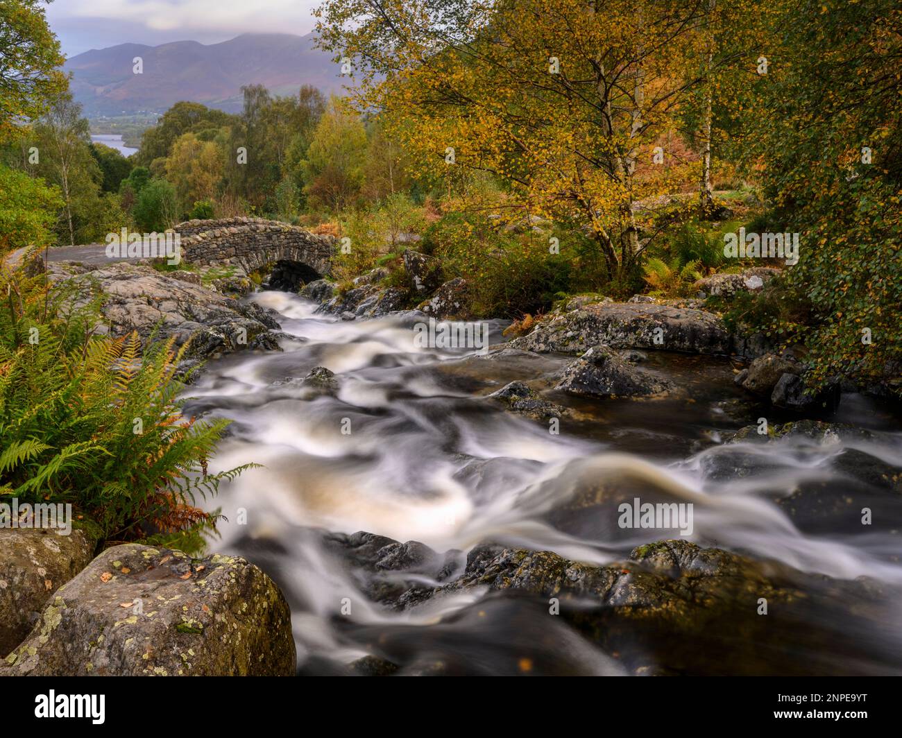 Water tumbling over rocks towards Ashness Bridge in the Lake District ...