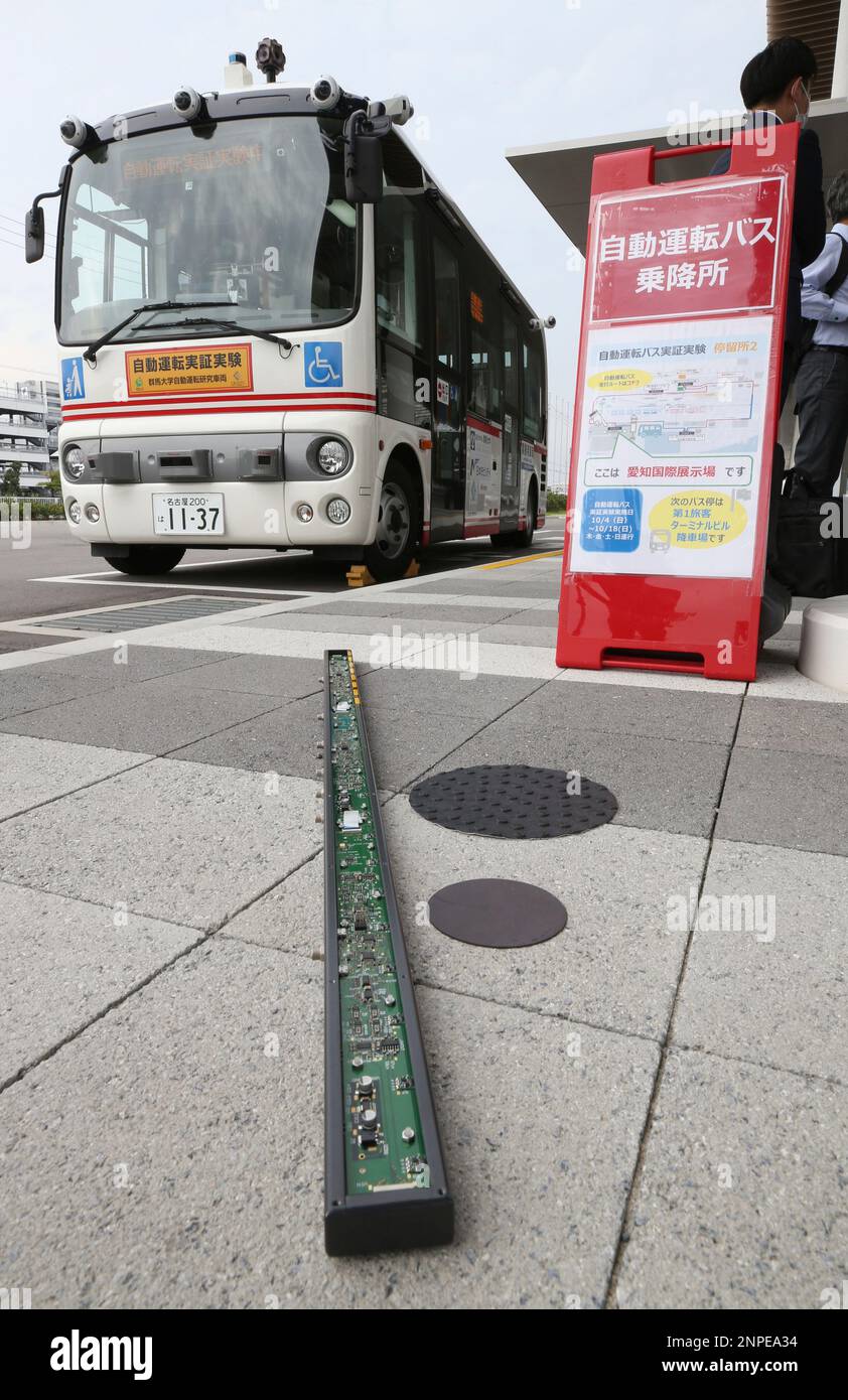 A self-driving small bus test is conducted as a driver remains unseated ...