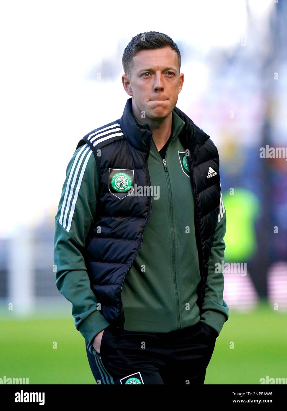 Celtic's Callum McGregor inspects the pitch ahead of the Viaplay Sports ...