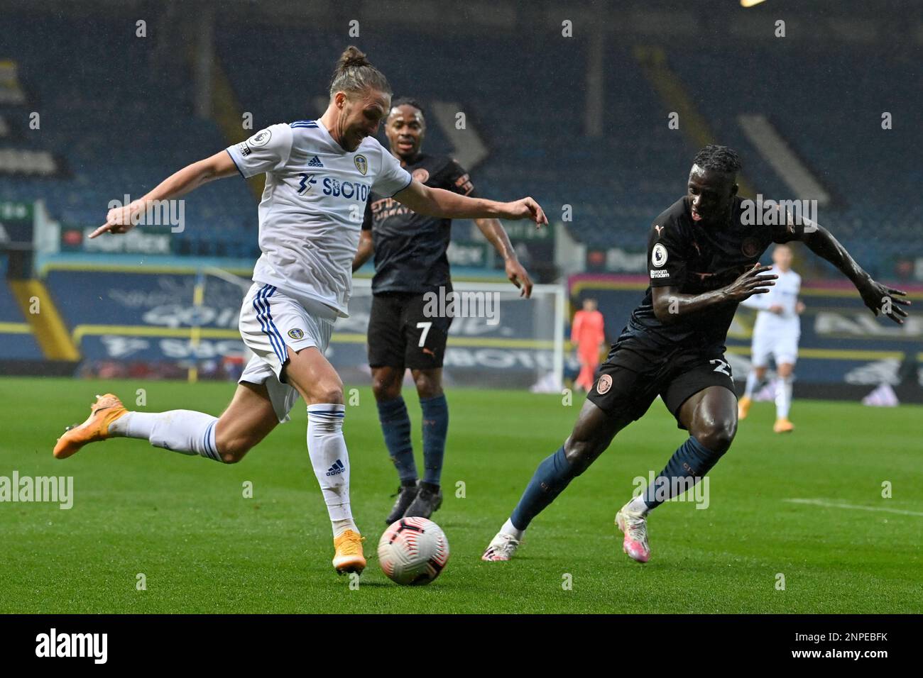 Leeds United's Luke Ayling, left, tries to get past Manchester City's ...