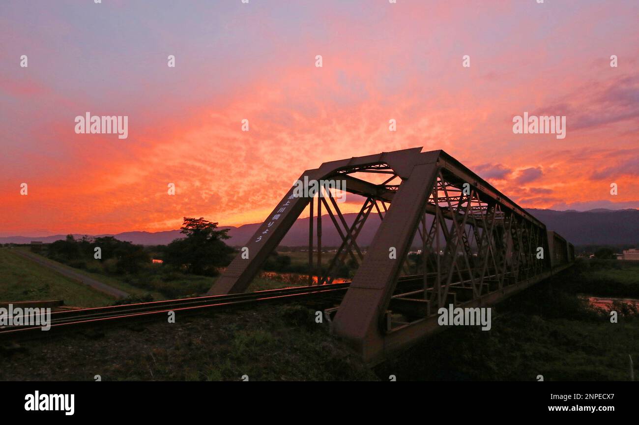 The Mogamigawa (Mogami River) Bridge of Yamagata Railway turns red ...