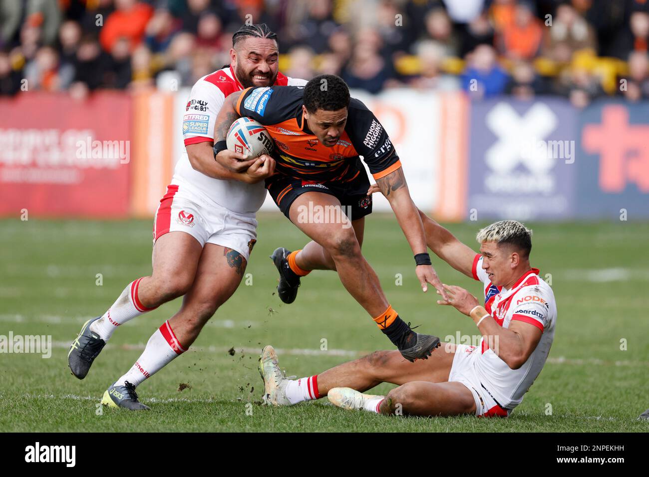 Castleford Tigers Jordan Turner is tackled by Saint Helens Konrad ...