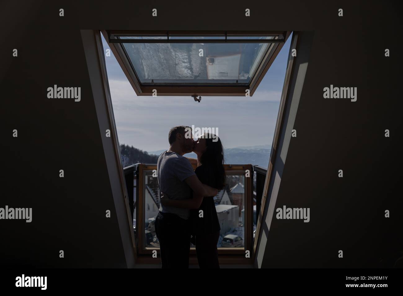 the couple hugs and kisses against the backdrop of the beautiful ...