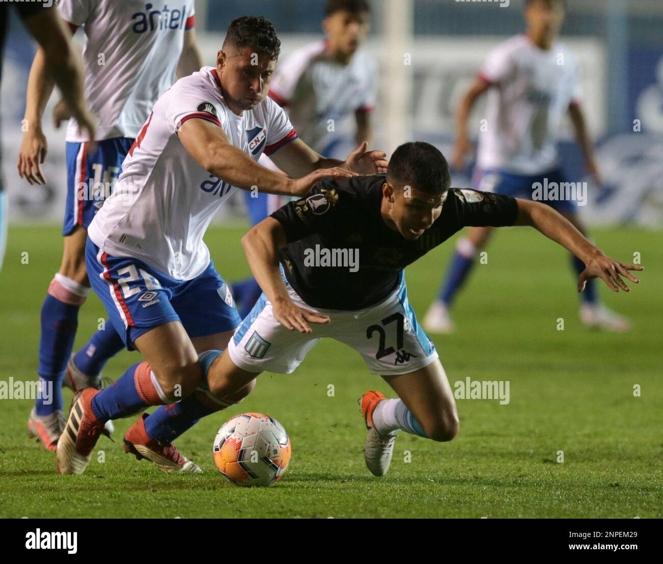 Pablo Garcia of Uruguay's Nacional, left, and Tiago Banega of Argentina ...