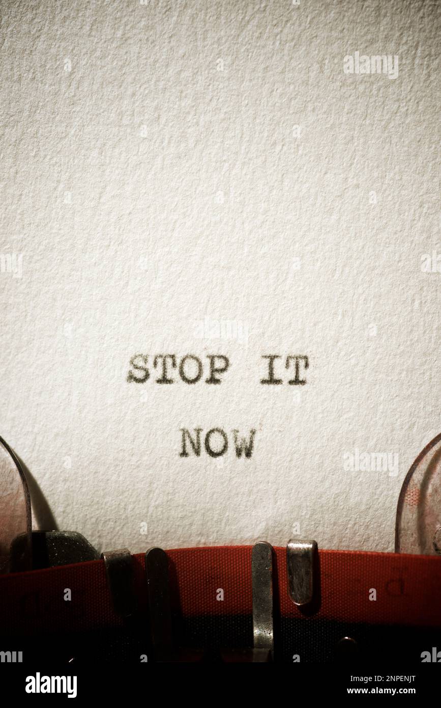 Stop it now text written with a typewriter Stock Photo - Alamy